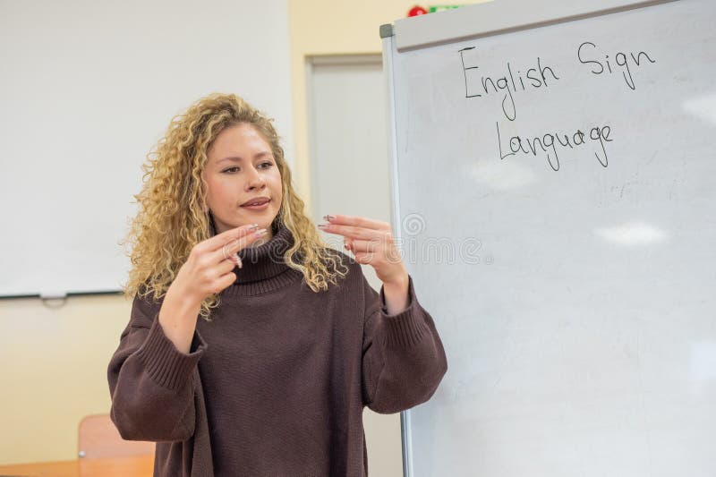 Caucasian Female Teacher Communicates in Russian Sign Language with ...