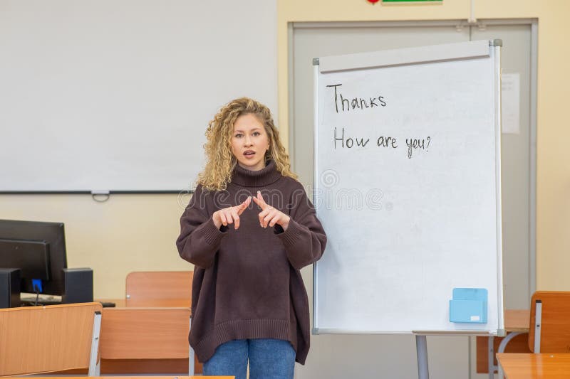 Caucasian Female Teacher Communicates in Russian Sign Language with ...