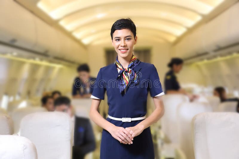 Flight Attendant Is Welcoming And Checking Passenger Boarding Pass In Business Class And Show