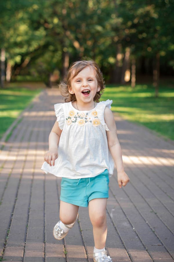 A Caucasian Girl is Running on the Road Stock Photo - Image of portrait ...