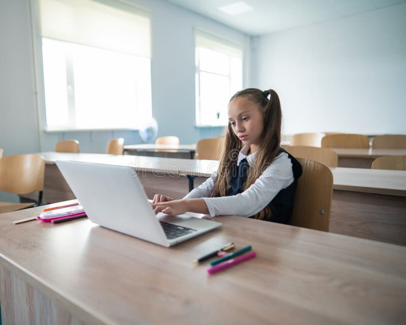 Caucasian Girl Studying on a Laptop in a Classroom. Stock Image - Image ...