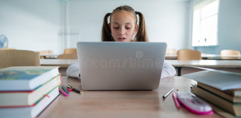 Caucasian Girl Studying on a Laptop in a Classroom. Stock Image - Image ...