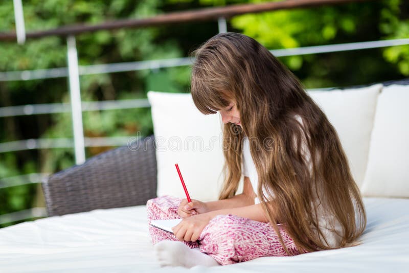 Caucasian Girl Writing at Notepad Stock Image - Image of children ...