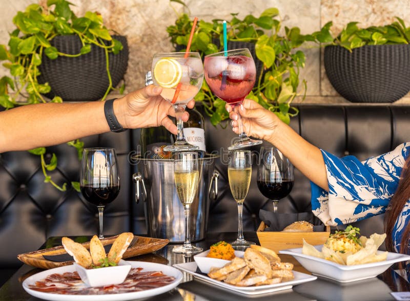 Caucasian Hands Cheering with Cocktail Glasses Stock Image - Image of ...