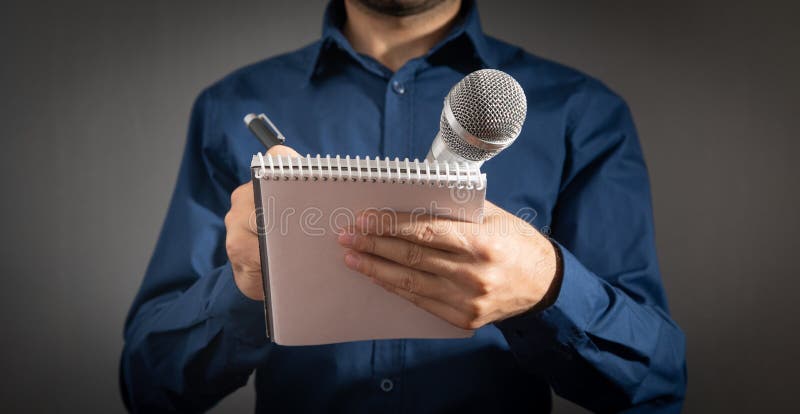 Caucasian Journalist Holding Microphone, Notepad and Pen Stock Image ...