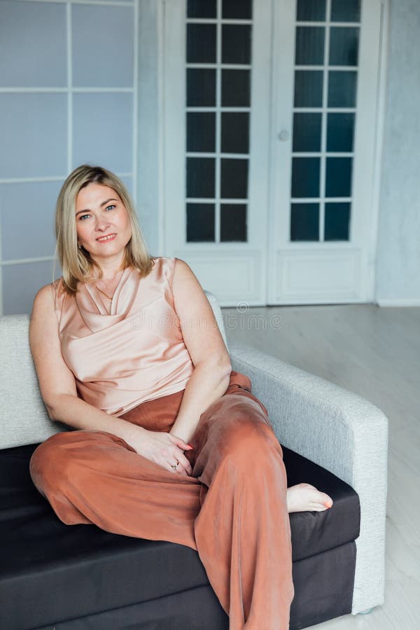 Beautiful Caucasian Lady Sit Down on the Sofa Stock Image - Image of home, chat: 297239271