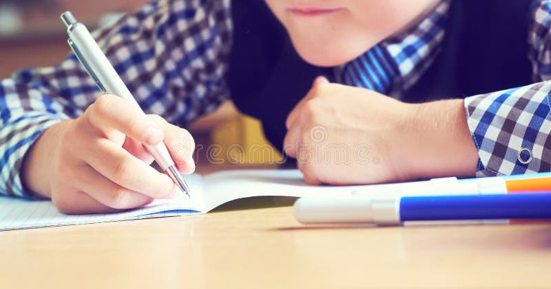 Caucasian Little Boy Holding Pen and Writing in Notebook. Close Up ...