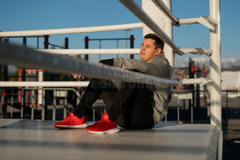Caucasian Male Boxer Resting in the Ring Outdoors. Stock Image - Image ...