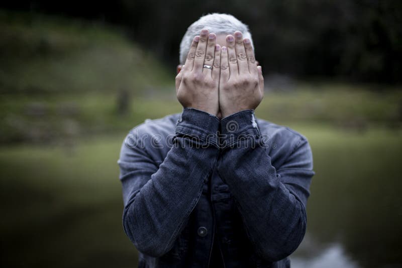 Caucasian Male Closing His Face with His Hands Stock Image - Image of ...