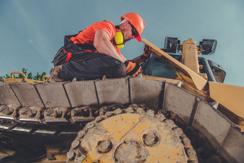 Bulldozer Operator Checking the Track Stock Photo - Image of worker ...