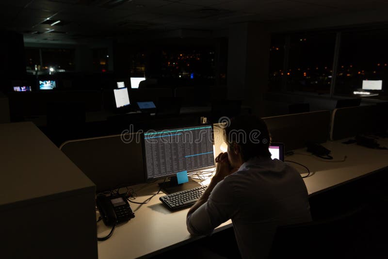 Caucasian Male Programmer Sitting at Desk, Using Computer with Coding on Screen Stock Photo ...