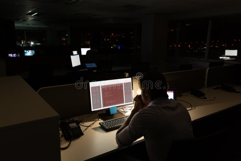 Caucasian Male Programmer Sitting at Desk, Using Computer with Coding on Screen Stock Photo ...