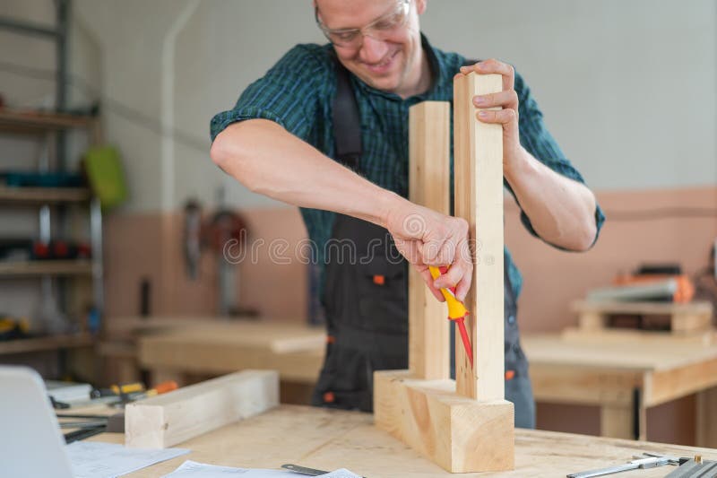 Caucasian Man Assembling a Table with a Screwdriver. Stock Image ...