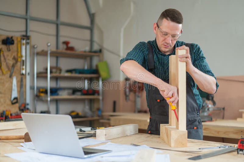 Caucasian Man Assembling a Table with a Screwdriver. Stock Photo ...