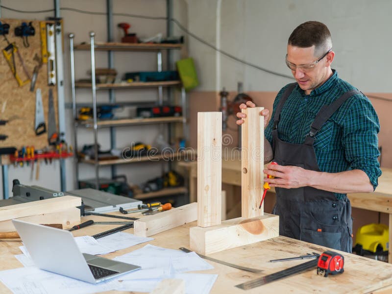 Caucasian Man Assembling a Table with a Screwdriver. Stock Photo ...