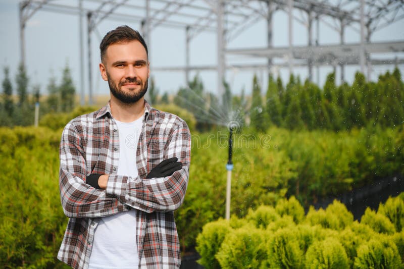 Caucasian Man Choosing Sprouts in Garden Center Stock Image - Image of ...