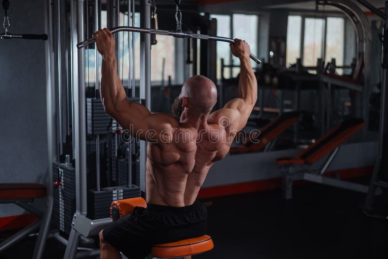 Caucasian Man Doing Lat Pull-downs on a Machine. Stock Image - Image of ... Caucasian Man Doing Lat Pull-downs on a Machine. Stock Image - Image of ...