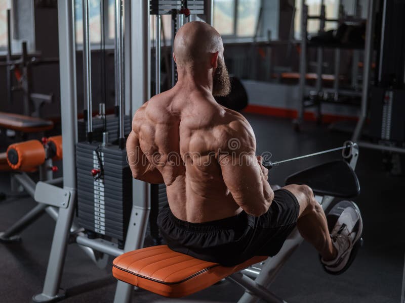 Caucasian Man Doing Rowing Exercises on a Rowing Machine. Stock Photo ...