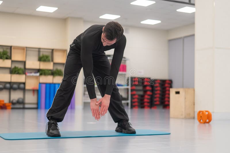 Caucasian Man Doing Warm-up before Exercise at a Climbing Wall. Stock ...