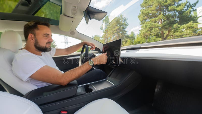 Caucasian Man Driving a Modern Electric Car. Stock Image - Image of ...