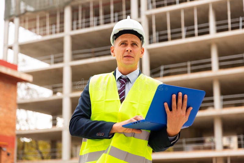 Engineer with Laptop on Construction Site Stock Photo - Image of ...
