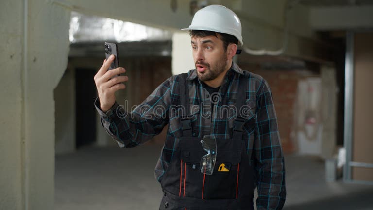 Caucasian Man Foreman Builder Talking Mobile Phone on Construction Site ...