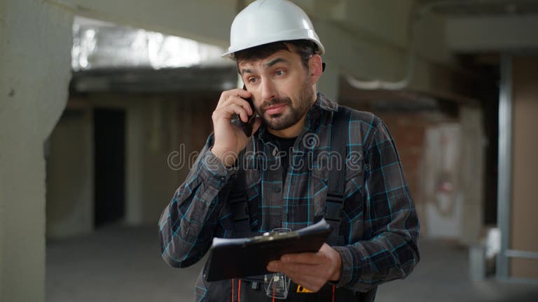 Caucasian Man Foreman Builder Talking Mobile Phone on Construction Site ...