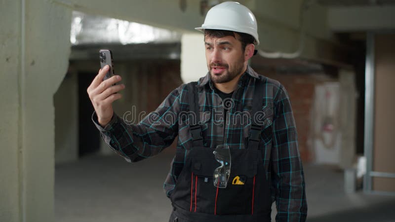 Caucasian Man Foreman Builder Talking Mobile Phone on Construction Site ...