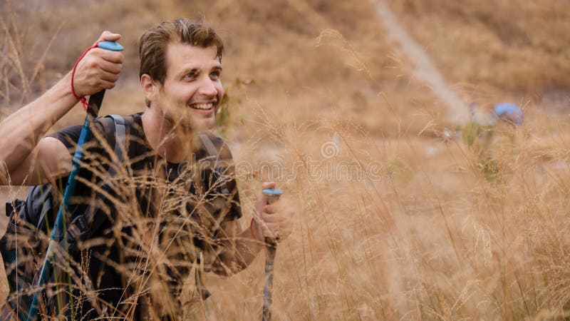 Caucasian Man Hiker Having Fun Walking Up Mountain on Trail with Dry ... Caucasian Man Hiker Having Fun Walking Up Mountain on Trail with Dry ...