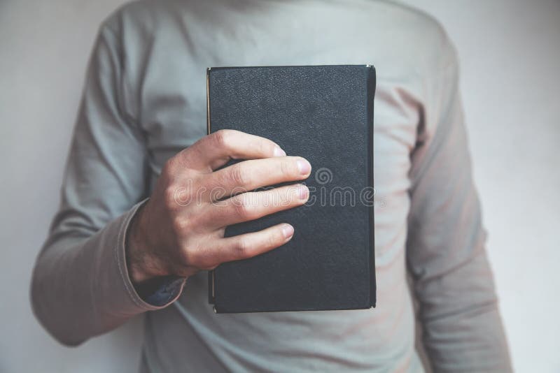 Caucasian Man Holding Bible. Stock Image - Image of grey, preacher ...