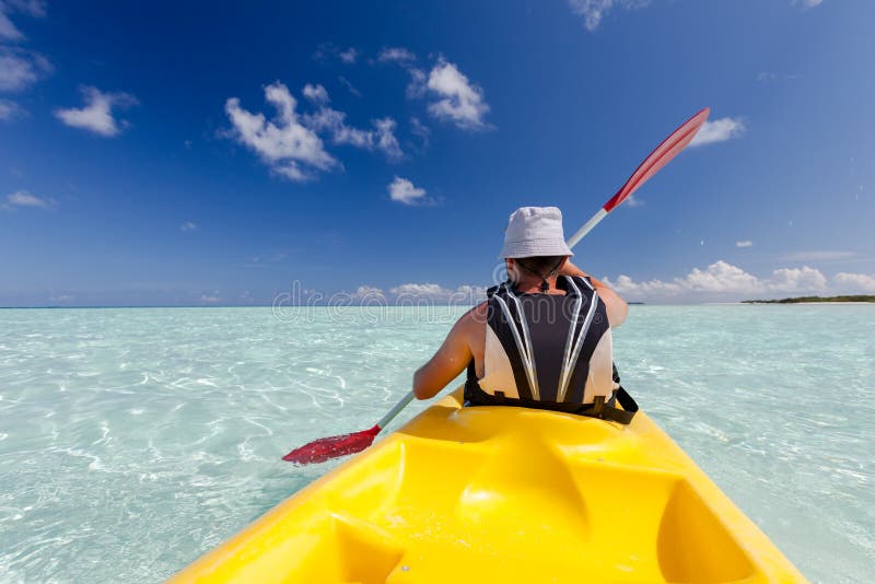 Caucasian Man Kayaking in Sea at Maldives Stock Photo - Image of ...