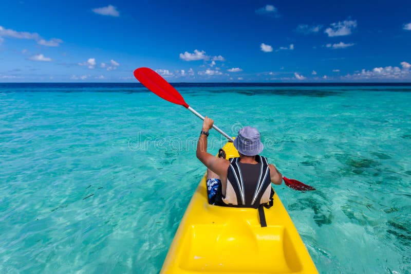 Caucasian Man Kayaking in Sea at Maldives Stock Image - Image of ...