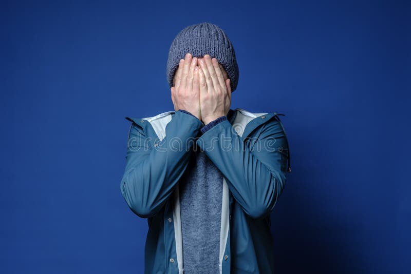Hiding from his problems. stock photo. Image of confusion - 41876020