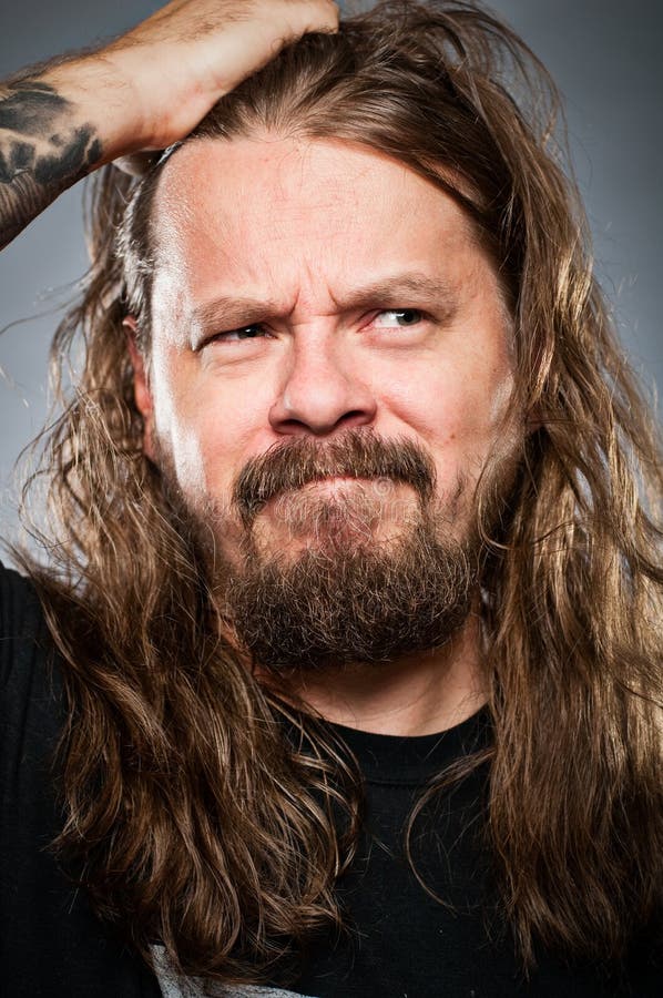 Caucasian Man with Long Hair Looking Confused Stock Photo - Image of ...