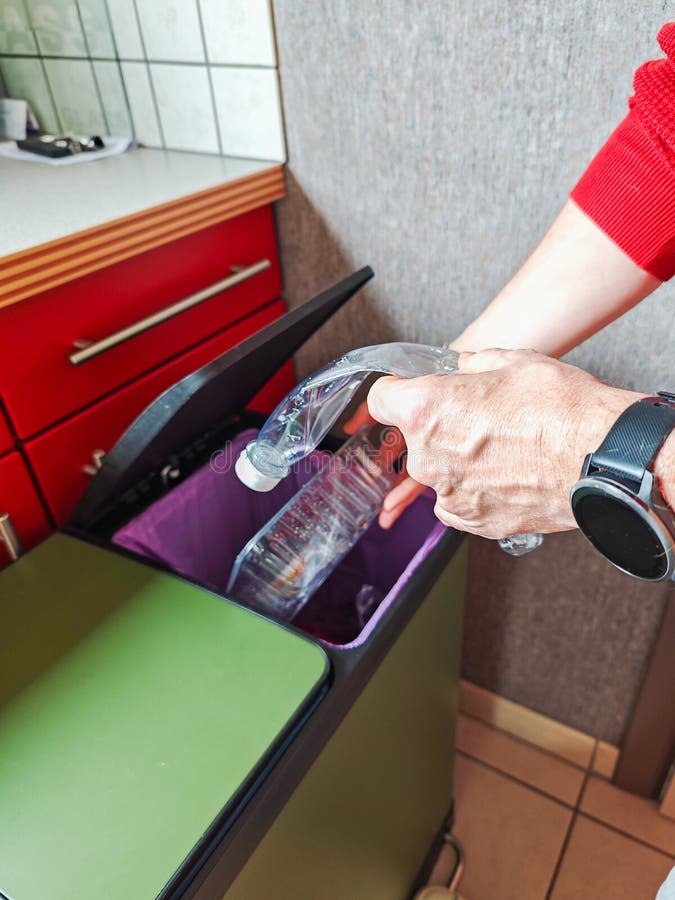 Caucasian Man, Partialy Visible, Arm Putting a Used Empty Plastic ...
