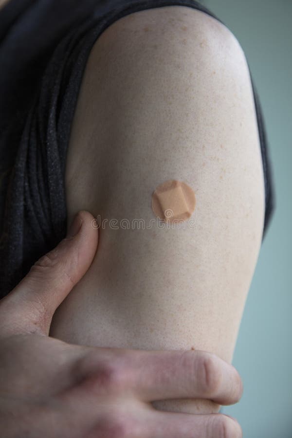 Caucasian Man with a Plaster on Their Arm after a Vaccination Injection ...