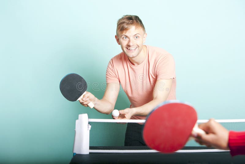 Caucasian Man Playing Table Tennis with Friend Stock Photo - Image of ...