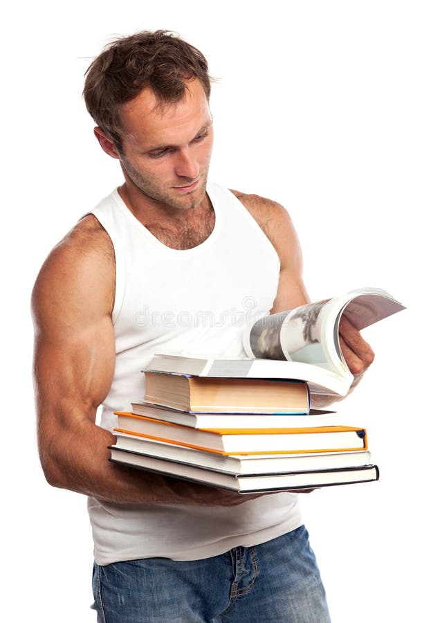 Handsome Man Studying at Desk with Lots of Books Stock Image - Image of ...