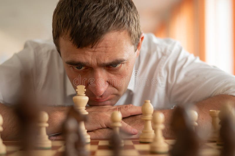 Caucasian Man Thinking about a Chess Move. Stock Image - Image of ...