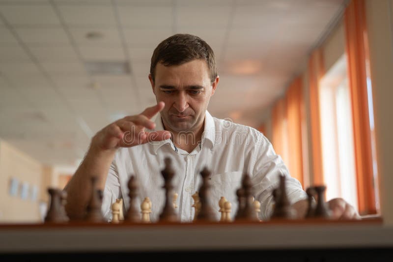 Caucasian Man Thinking about a Chess Move. Stock Photo - Image of ...