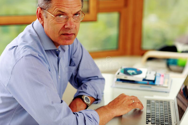 Caucasian Man Working on His Laptop Computer. Stock Photo - Image of ...