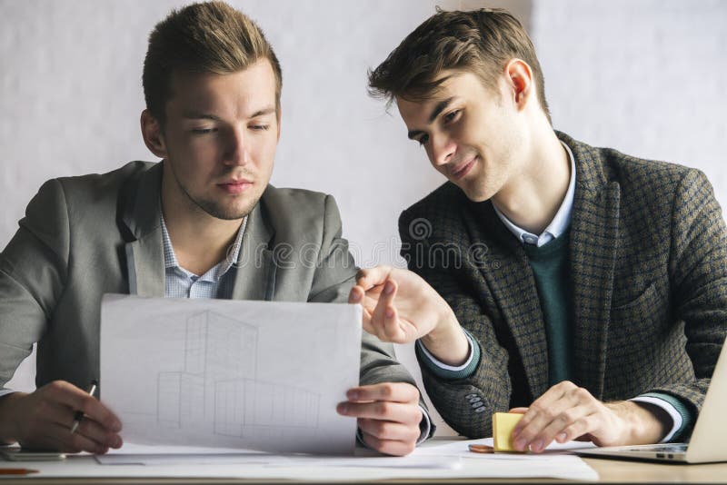 Caucasian Men Doing Paperwork Stock Photo - Image of discussing ...