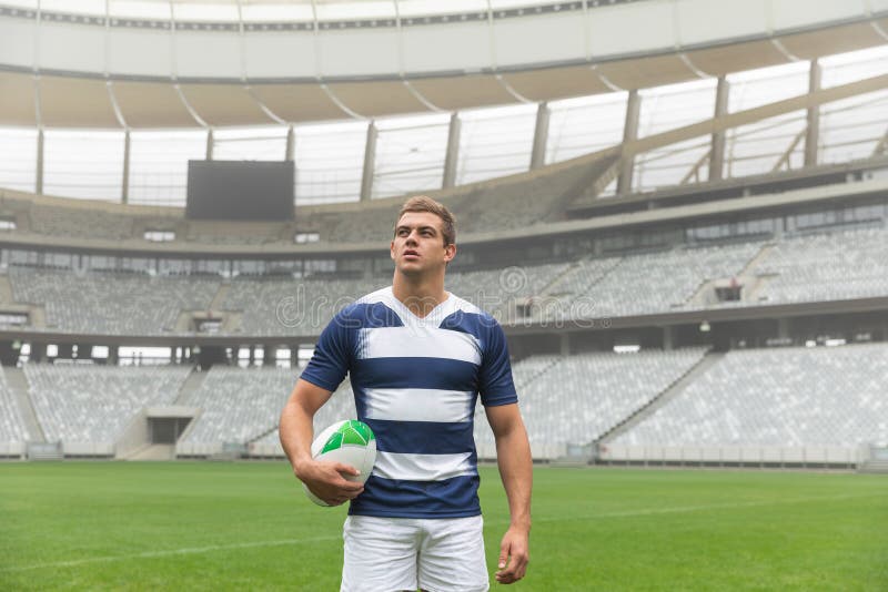 Caucasian Rugby Player Standing with Rugby Ball in Stadium Stock Photo ...