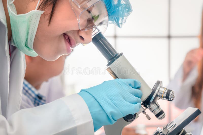 Science Class Using Microscope Uniform Stock Photos - Free & Royalty ...