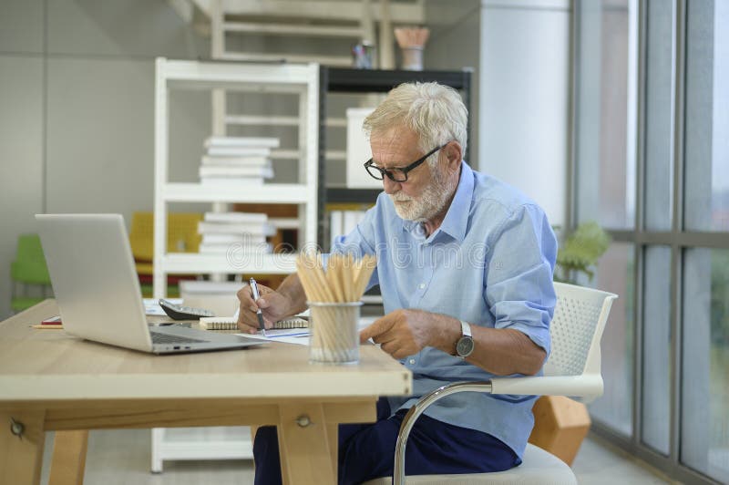 Caucasian Senior Businessman Working in Modern Office Stock Photo ...