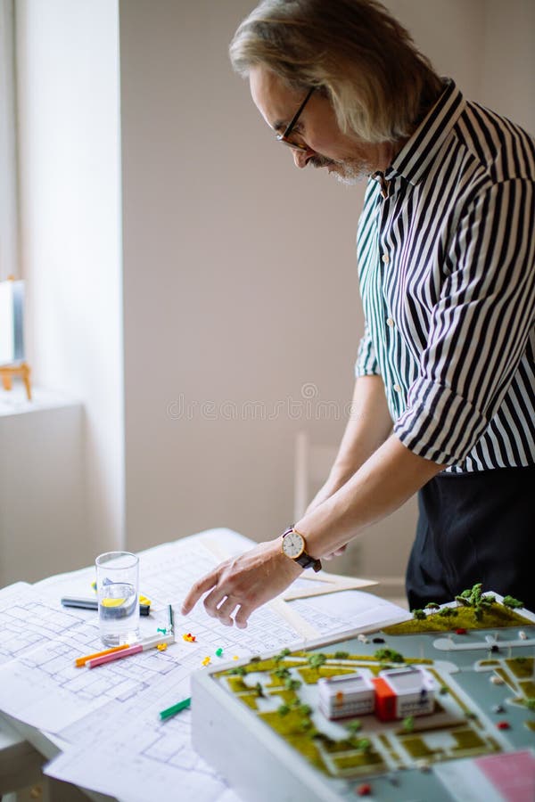 Senior Engineer Working in Office Stock Image - Image of mature ...