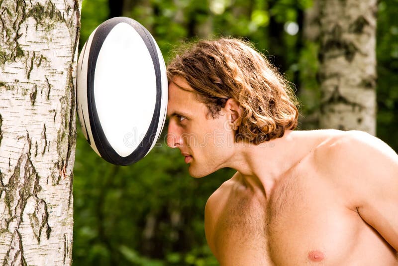Caucasian Strong Man Playing Rugby Ball Outdoors Stock Image - Image of ...