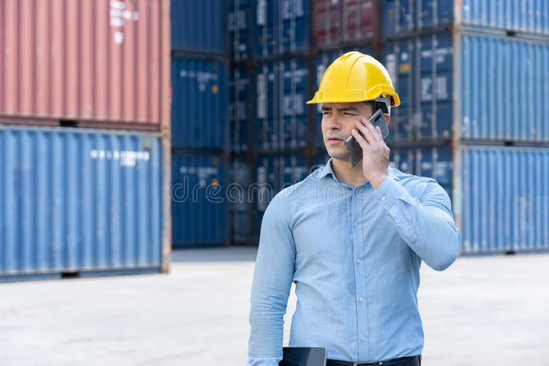 Caucasian Supervisor Talking on Mobile Phone at Logistic Cargo ...