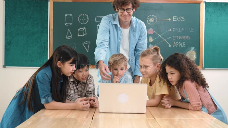 Student Use Laptop Writing Code while Teacher Explain about Program ...