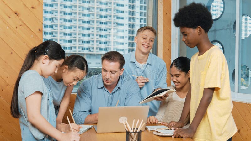 Caucasian Teacher Giving Comment or Advise Student at Classroom ...